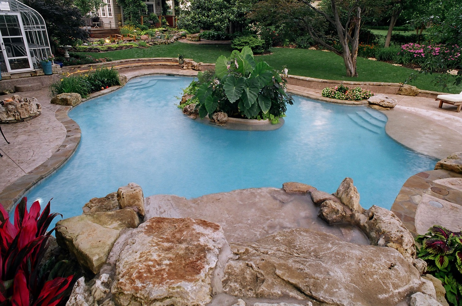 Free-form pools by Atlantis Pools & Spas Inc, Tulsa, Ok.