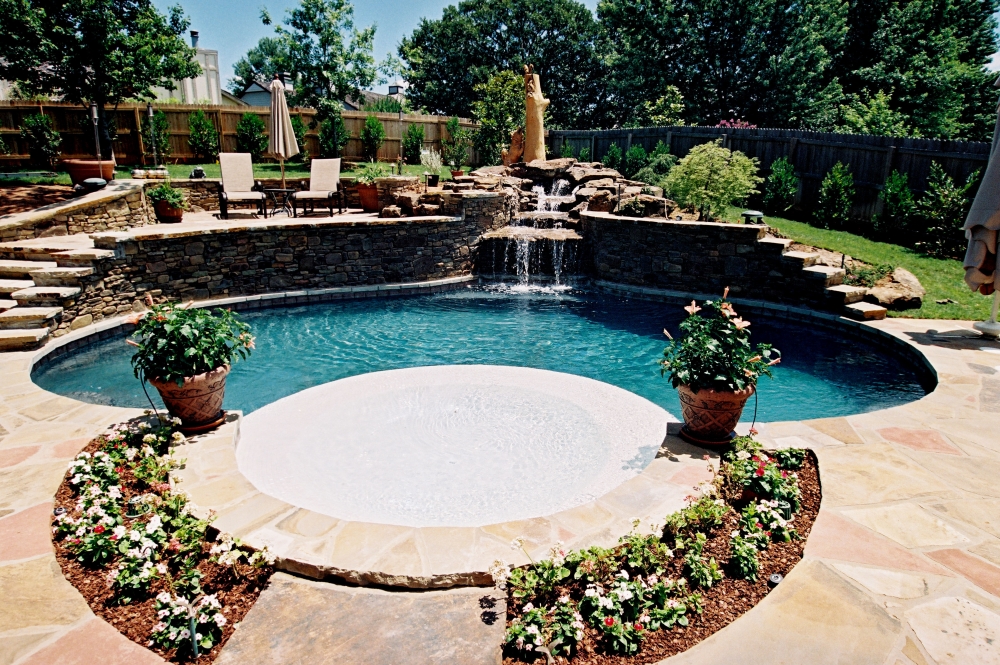 Free-form pools by Atlantis Pools & Spas Inc, Tulsa, Ok.